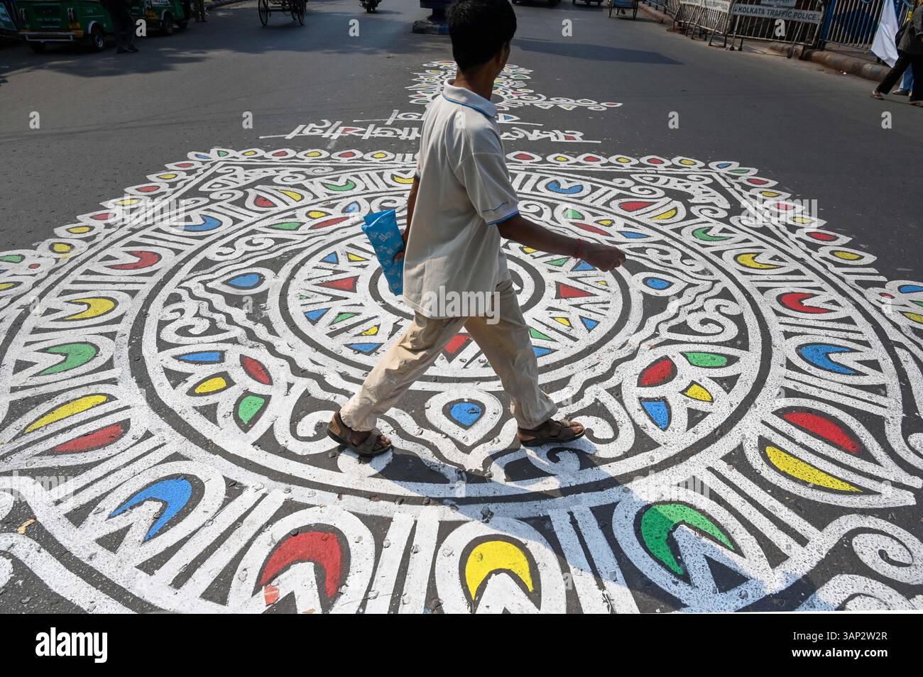 KOLKATA, INDIA - APRIL 15: People walked over colorful 'alpona ...