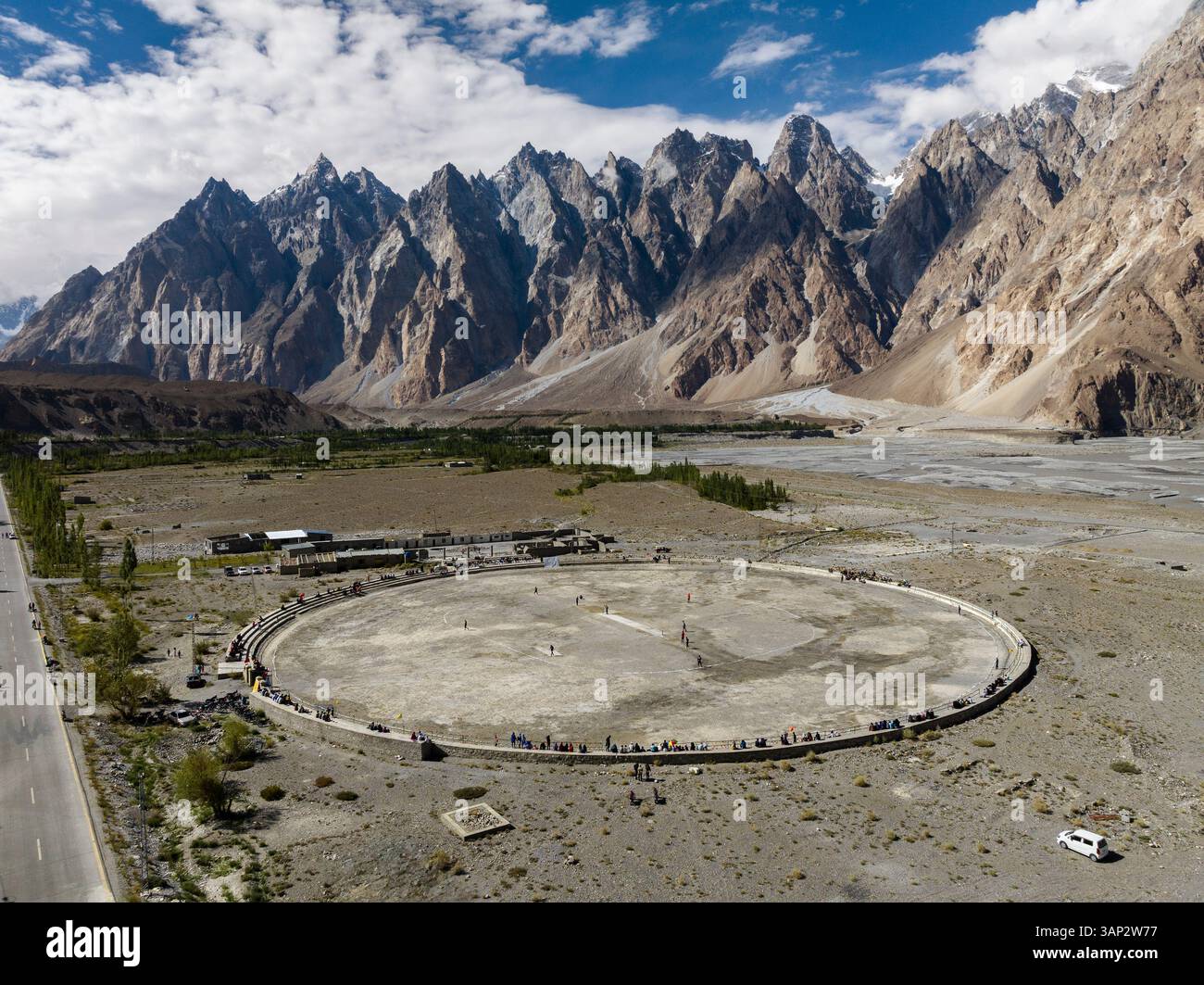 Aerial view of cricket match with Passu Cathedral right in back, Passu ...