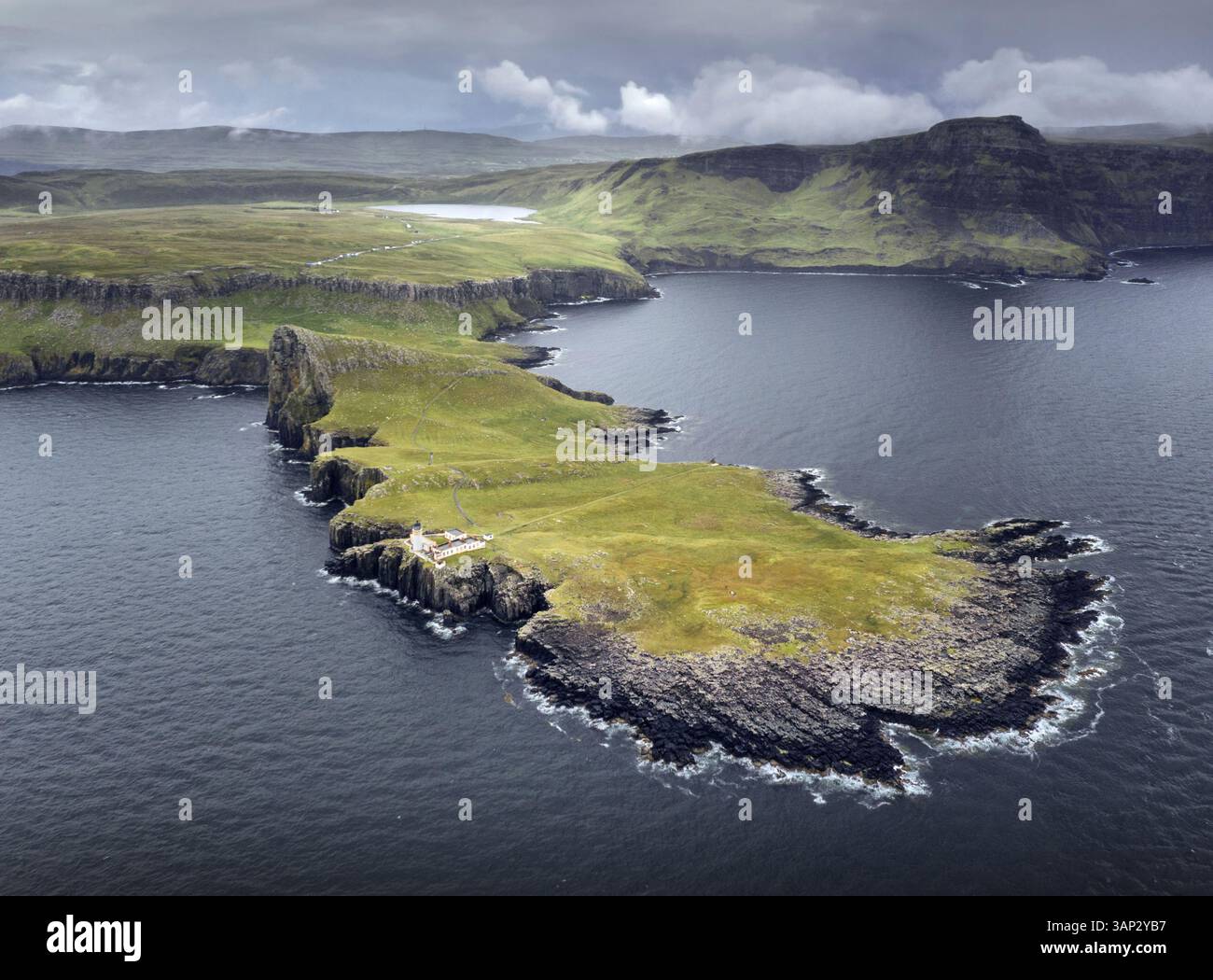 Aerial view of neist point lighthouse on a rugged cliff overlooking the ...