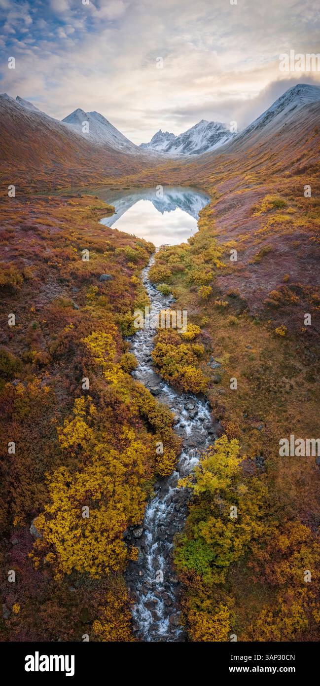 Aerial view of river and alpine lake surrounded by majestic alaskan ...