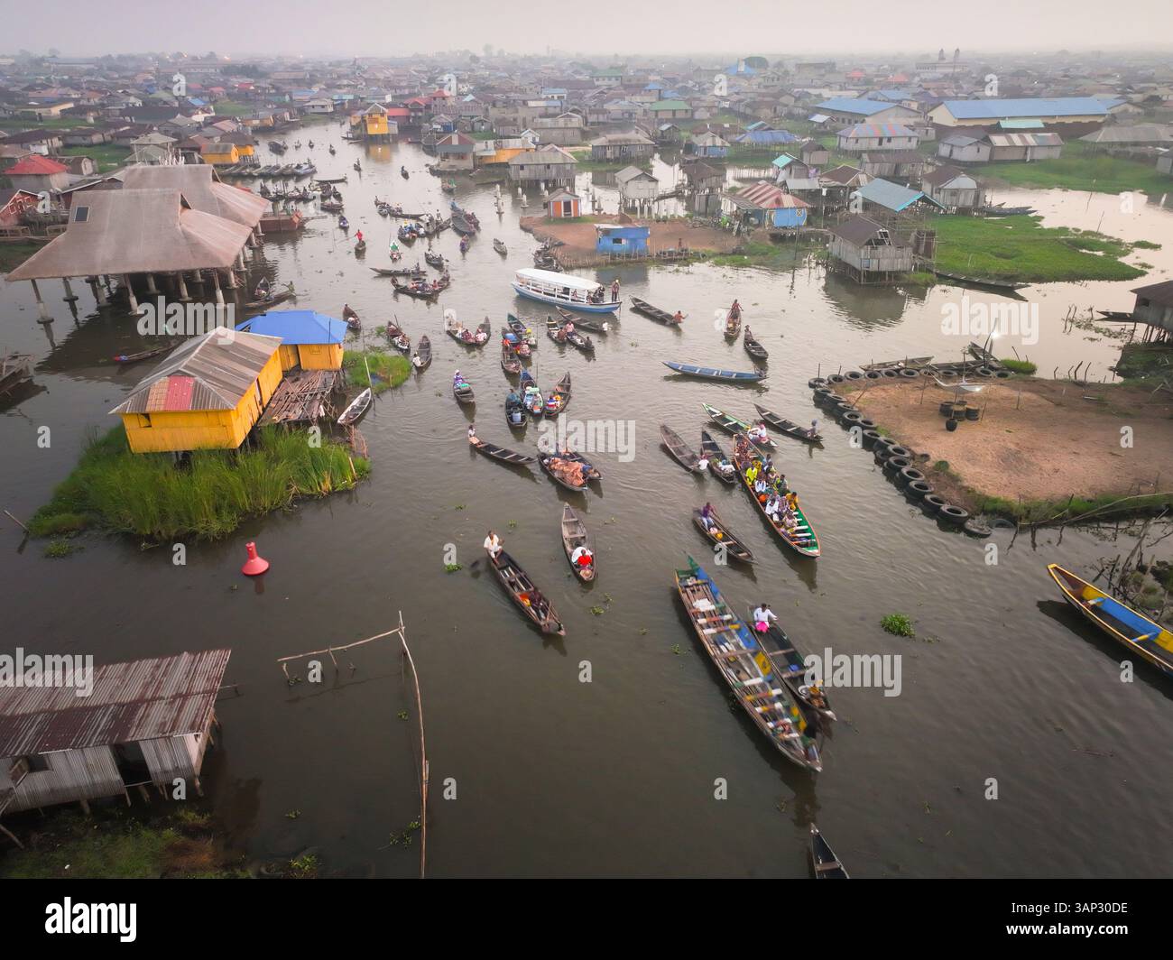 Aerial view of boats in a traditional african village on a tranquil ...