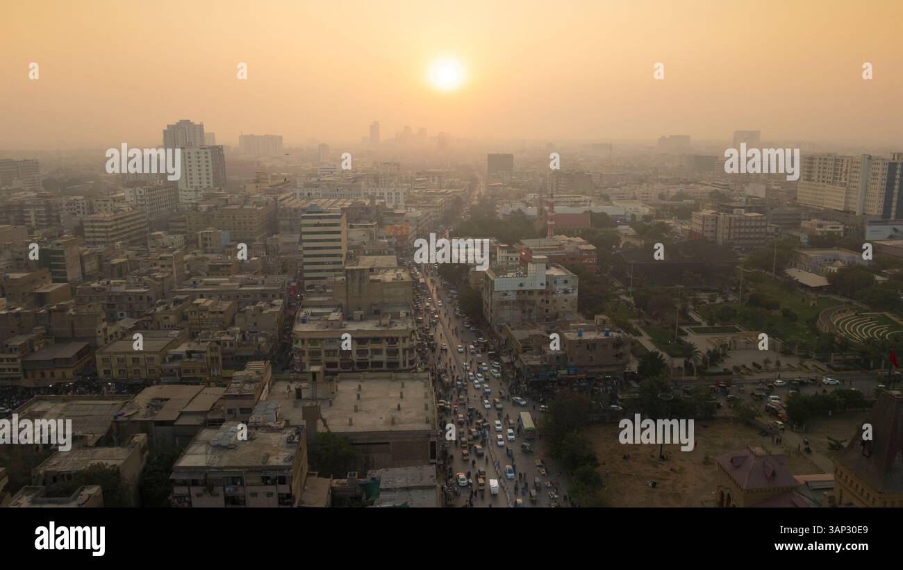 Aerial view of bustling traffic and modern buildings at sunset in ...