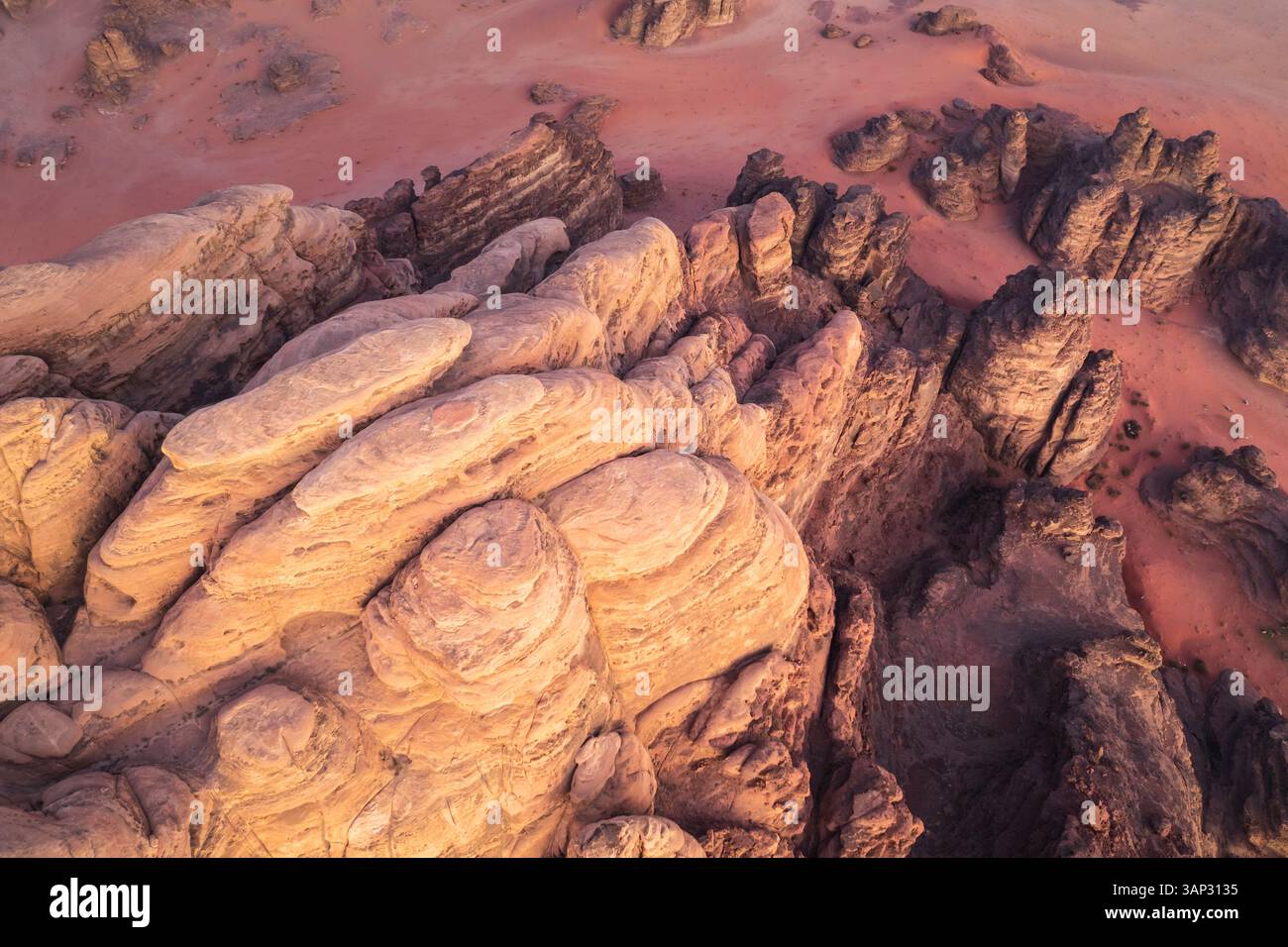 Aerial view of dramatic sandstone formations in the arid desert ...