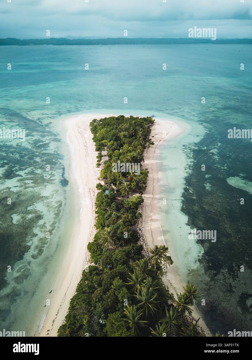 Aerial view of Cabgan Islet surrounded by turquoise water in Barobo ...