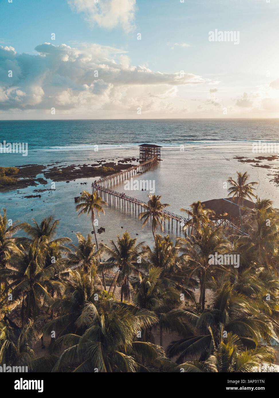 Aerial view of a pier at sunset in General Luna, Surigao del Norte ...