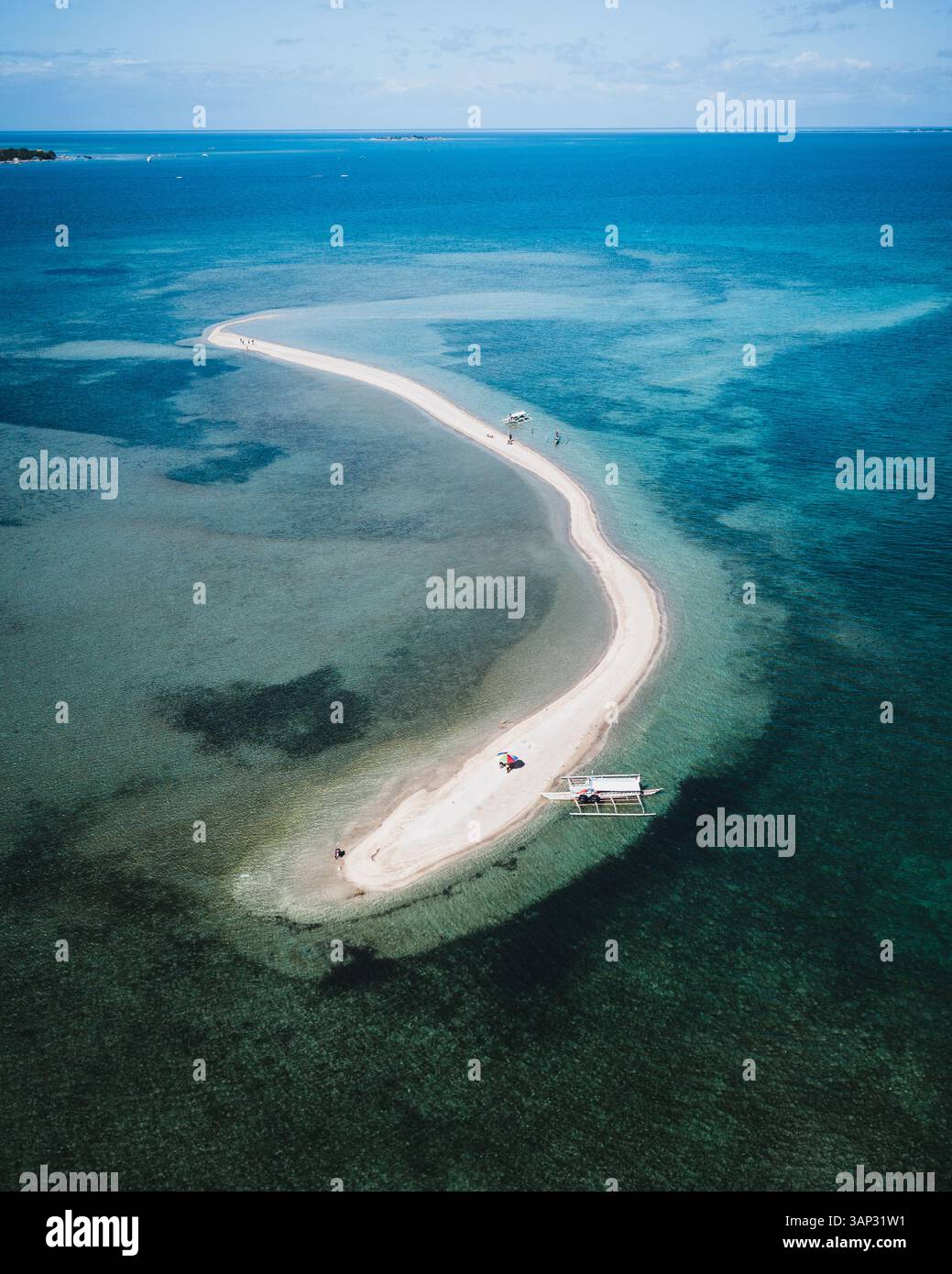 Aerial view of a sandy path in the middle of the sea in Talibon, Bohol ...