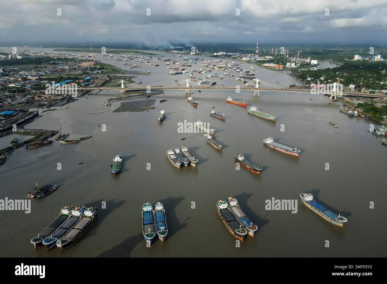 Aerial view of shah amanat bridge over karnafully river with ships and cargo vessels, Patiya ...
