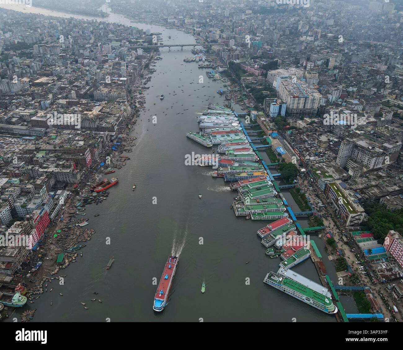 Aerial view of the bustling cityscape along the Buriganga River with ...