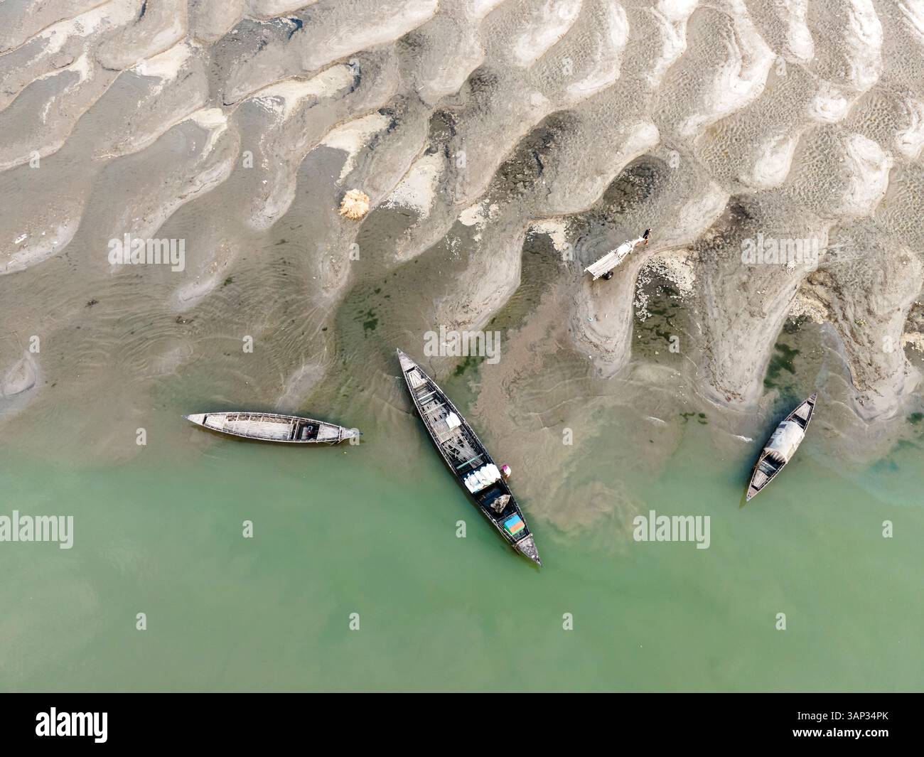 Aerial view of dry riverbed of Jamuna River with boats and sand ...