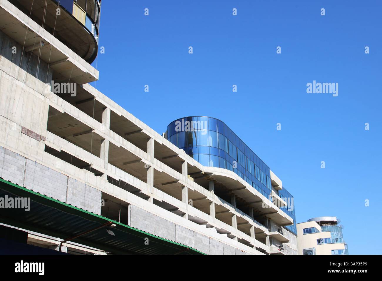 A modern building featuring a striking blue facade is presently under ...