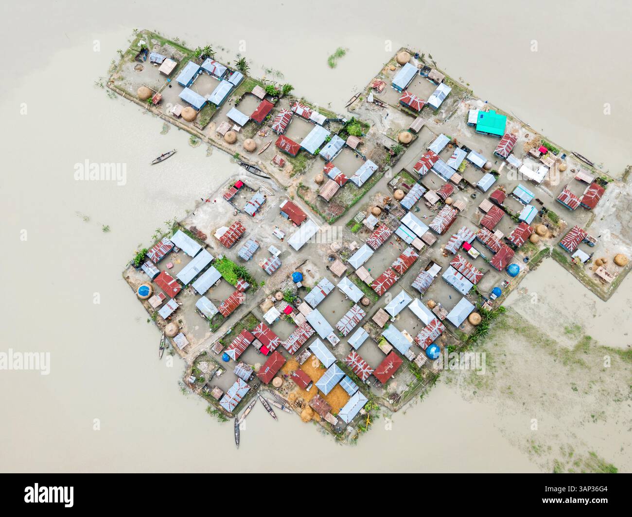 Aerial view of flooded streets with floating homes in a submerged and ...