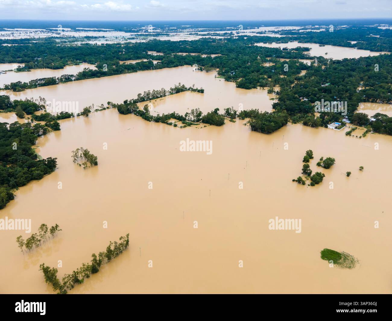 Aerial view of a flooded village with submerged homes and waterlogged ...
