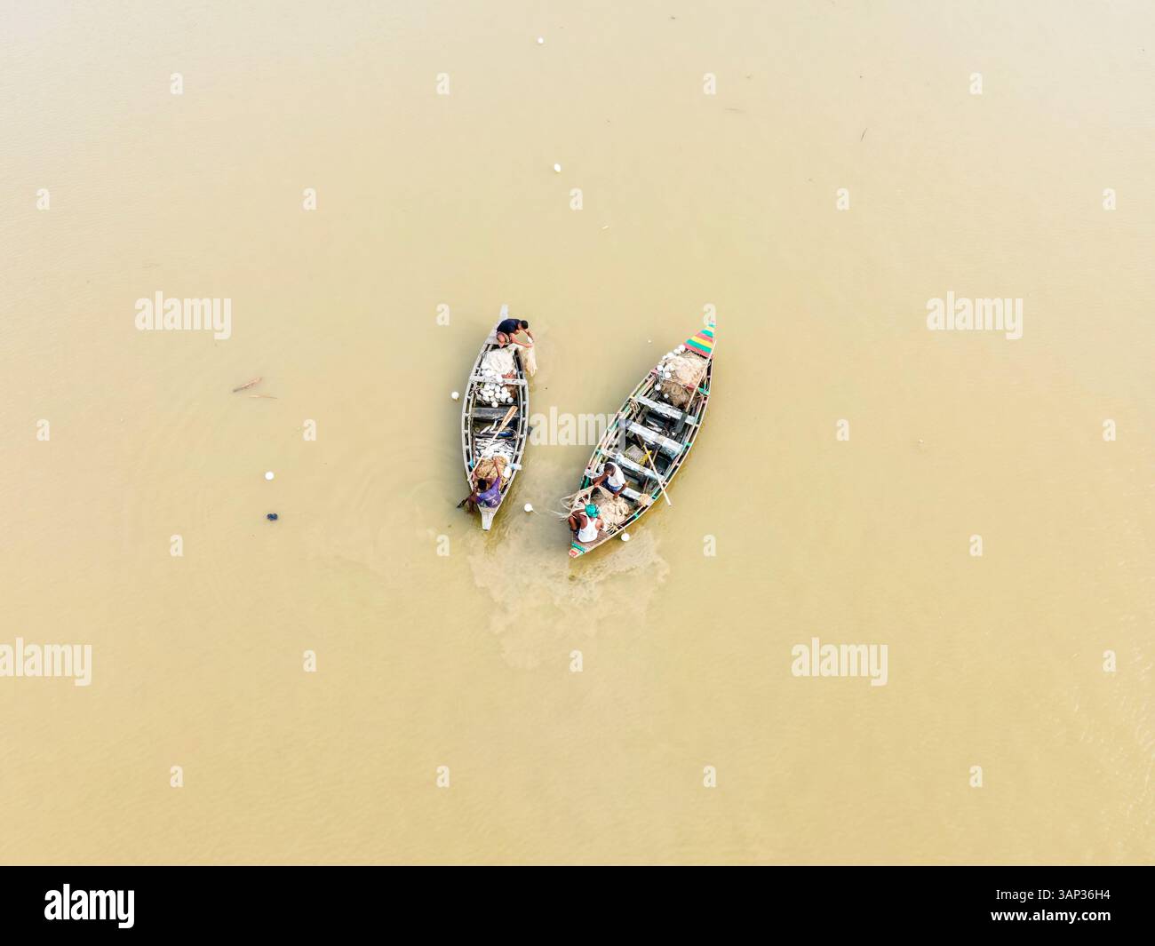 Aerial view of fishing boats navigating flood water in the Muhuri ...