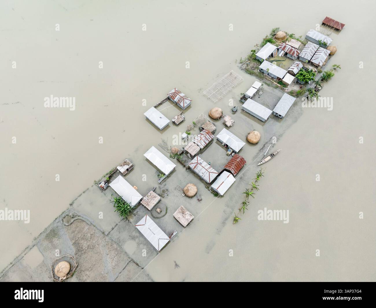 Aerial view of submerged and waterlogged village with floating homes amidst rising waters and ...