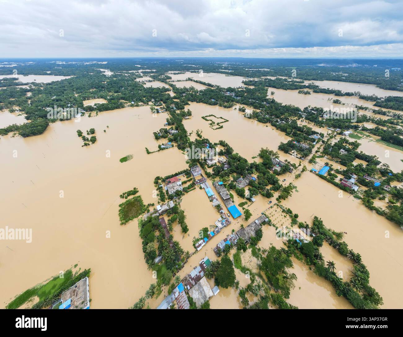 Aerial view of flooded village with submerged homes and waterlogged ...