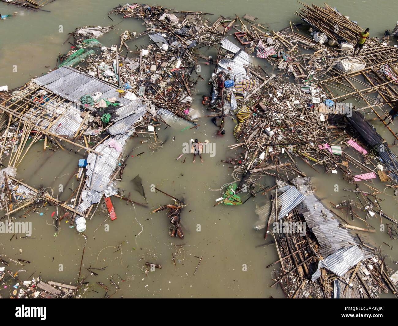 Aerial view of destroyed fishing village with wreckage and debris after ...
