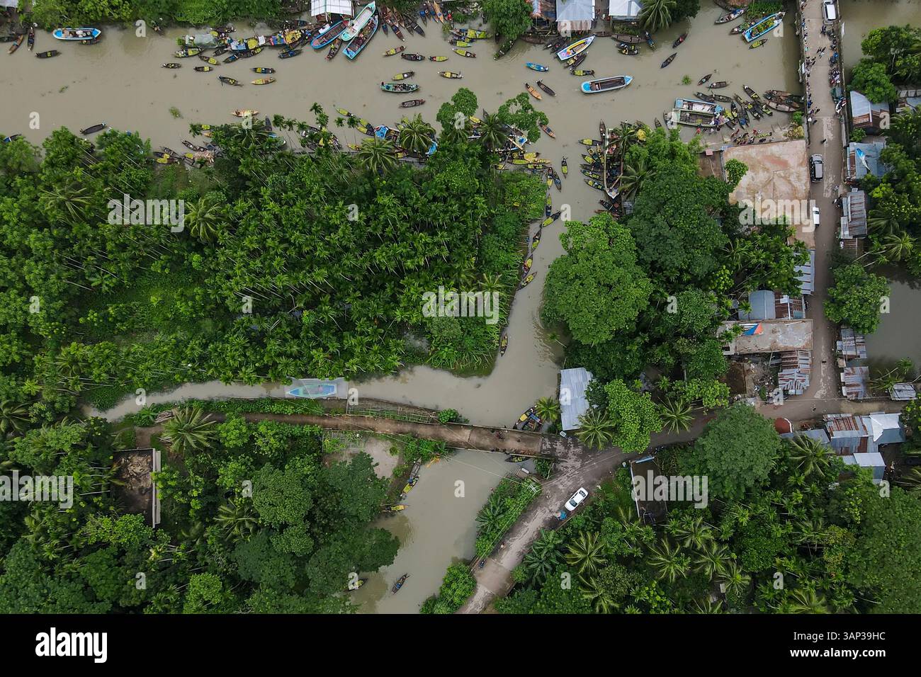 Aerial view of floating guava market with boats on a flooded river ...