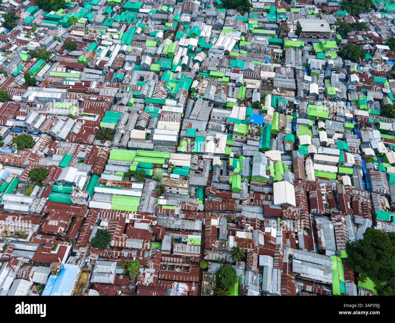 Aerial view of Banani Lake surrounded by colorful rooftops and dense ...