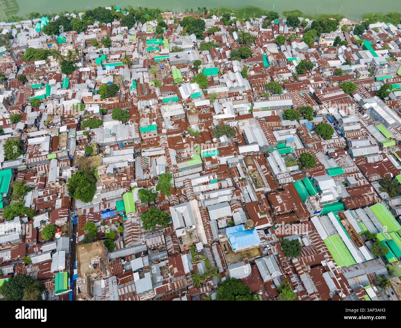 Aerial view of Banani Lake surrounded by dense Korail Slums and ...