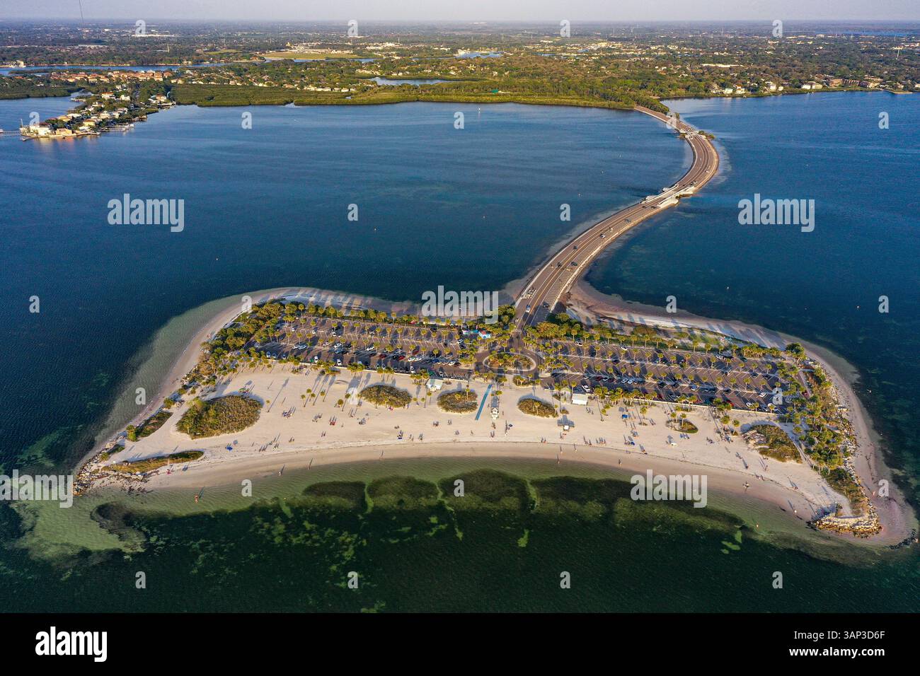 Aerial view of an island connected by a road with white sand and ...