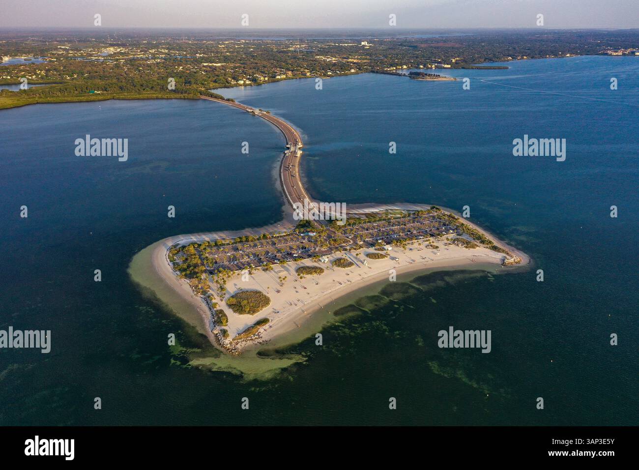 Aerial view of an island connected by a road with white sand and ...
