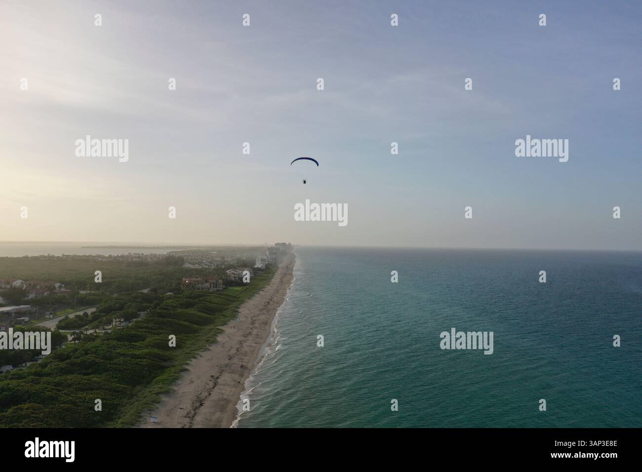 Flying along coast during sunset hi-res stock photography and images ...