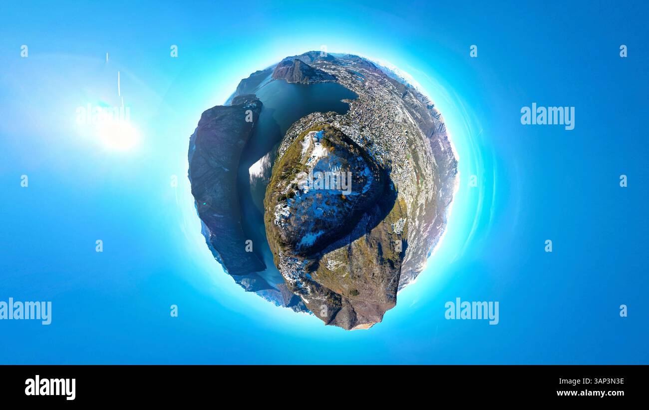 Aerial view of a tiny planet landscape featuring majestic mountains and ...