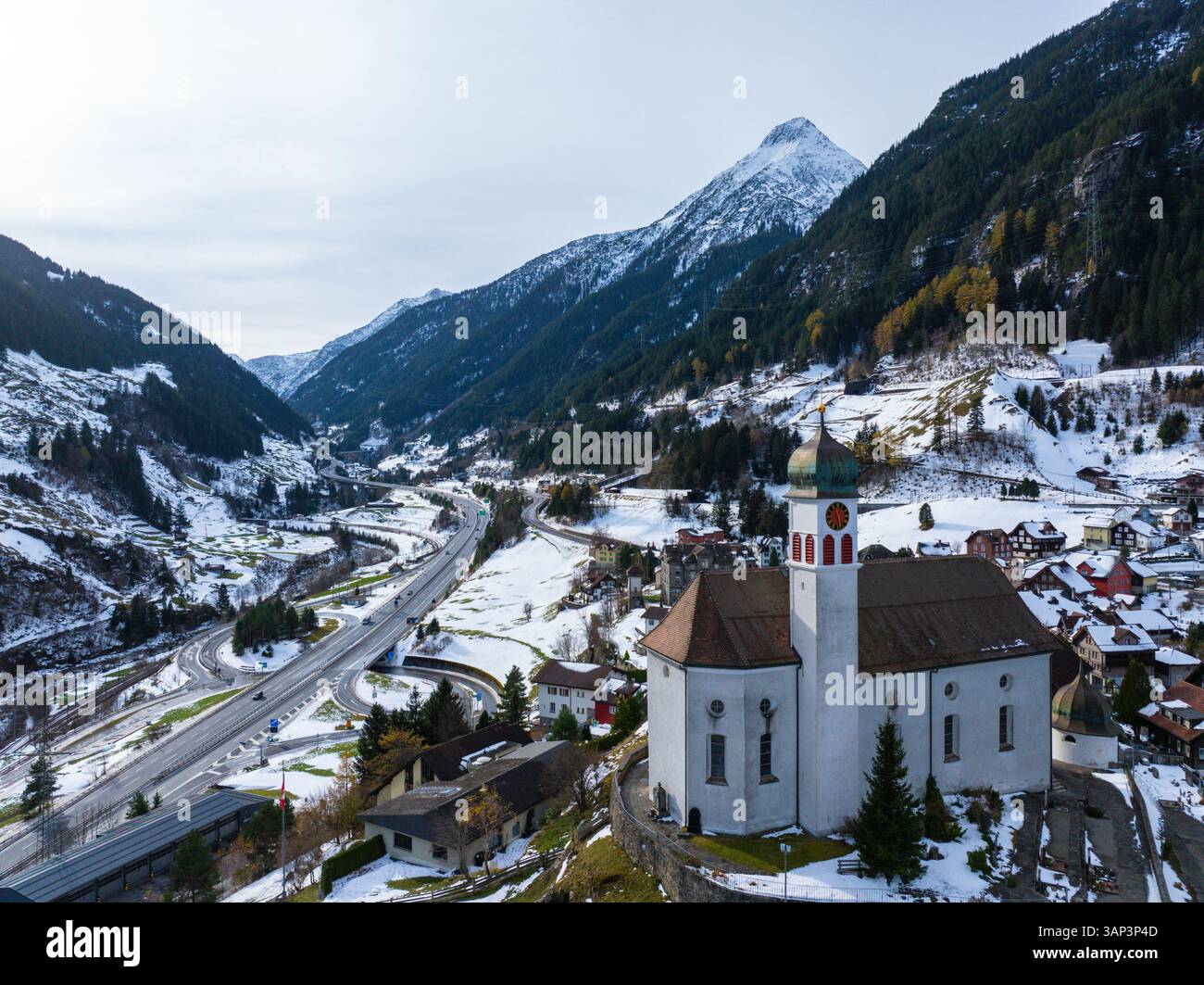 Aerial view of the beautiful Church of Wassen surrounded by majestic ...
