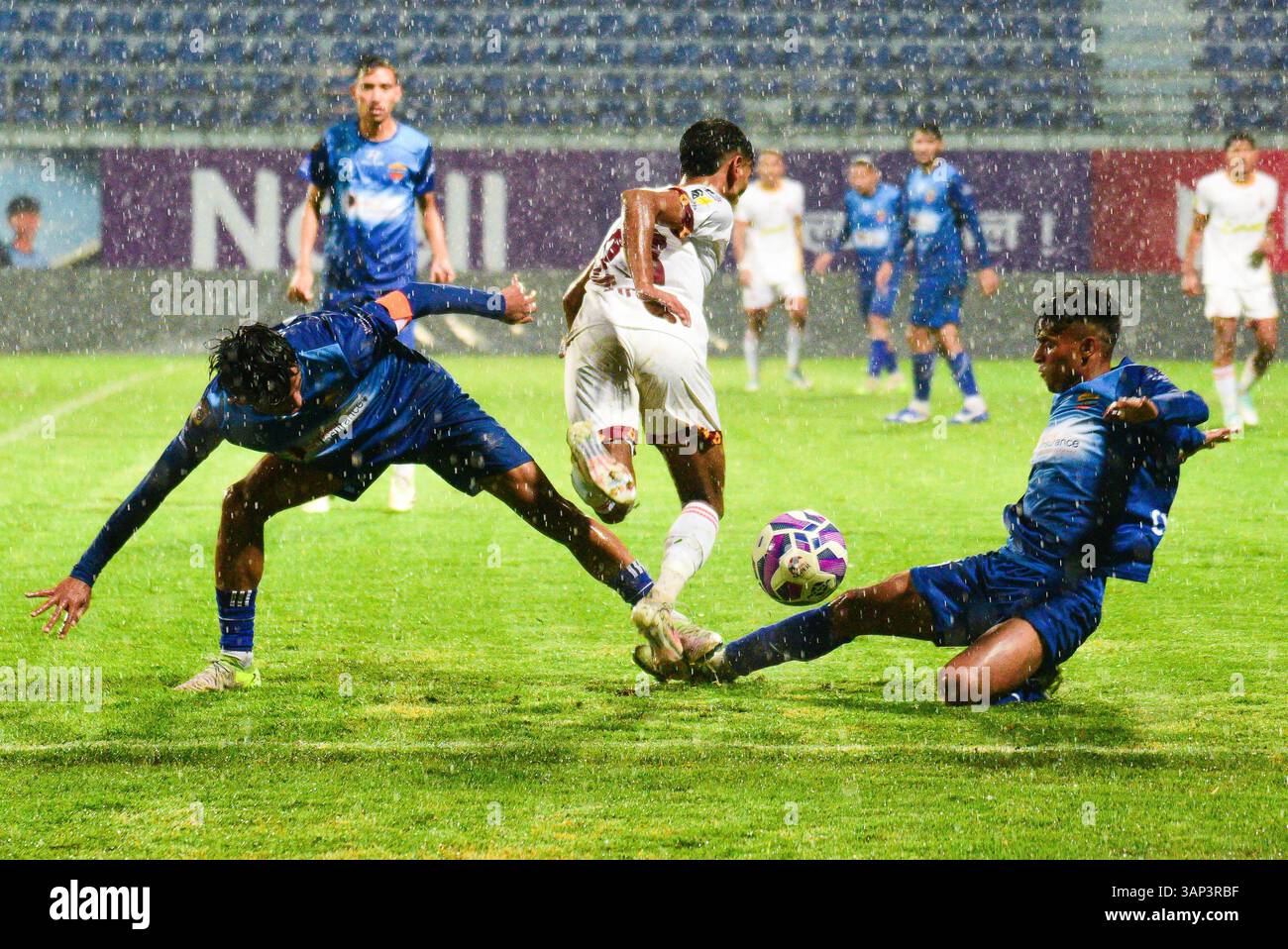 Kathmandu, Bagmati, Nepal. 15th Apr, 2025. SUMIT of Butwal Lumbini FC (white) is tackled by two ...