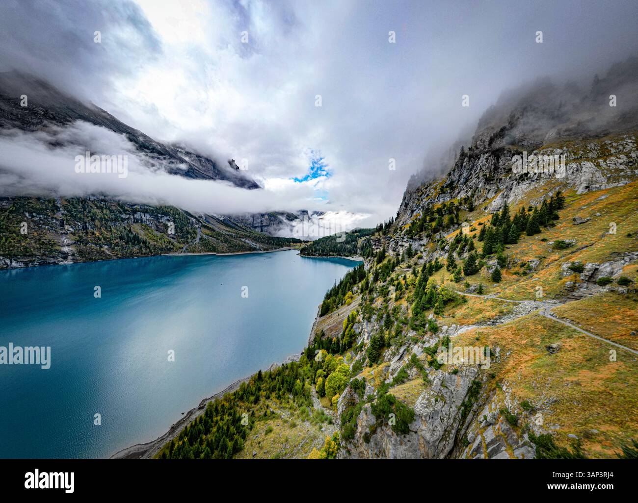 Aerial view of majestic Lake Oeschinen surrounded by Swiss Alps and ...