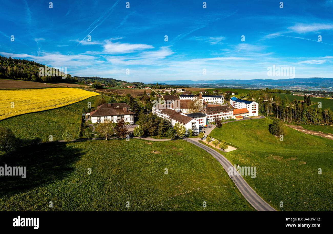 Aerial view of Cistercian abbey surrounded by fields and countryside ...
