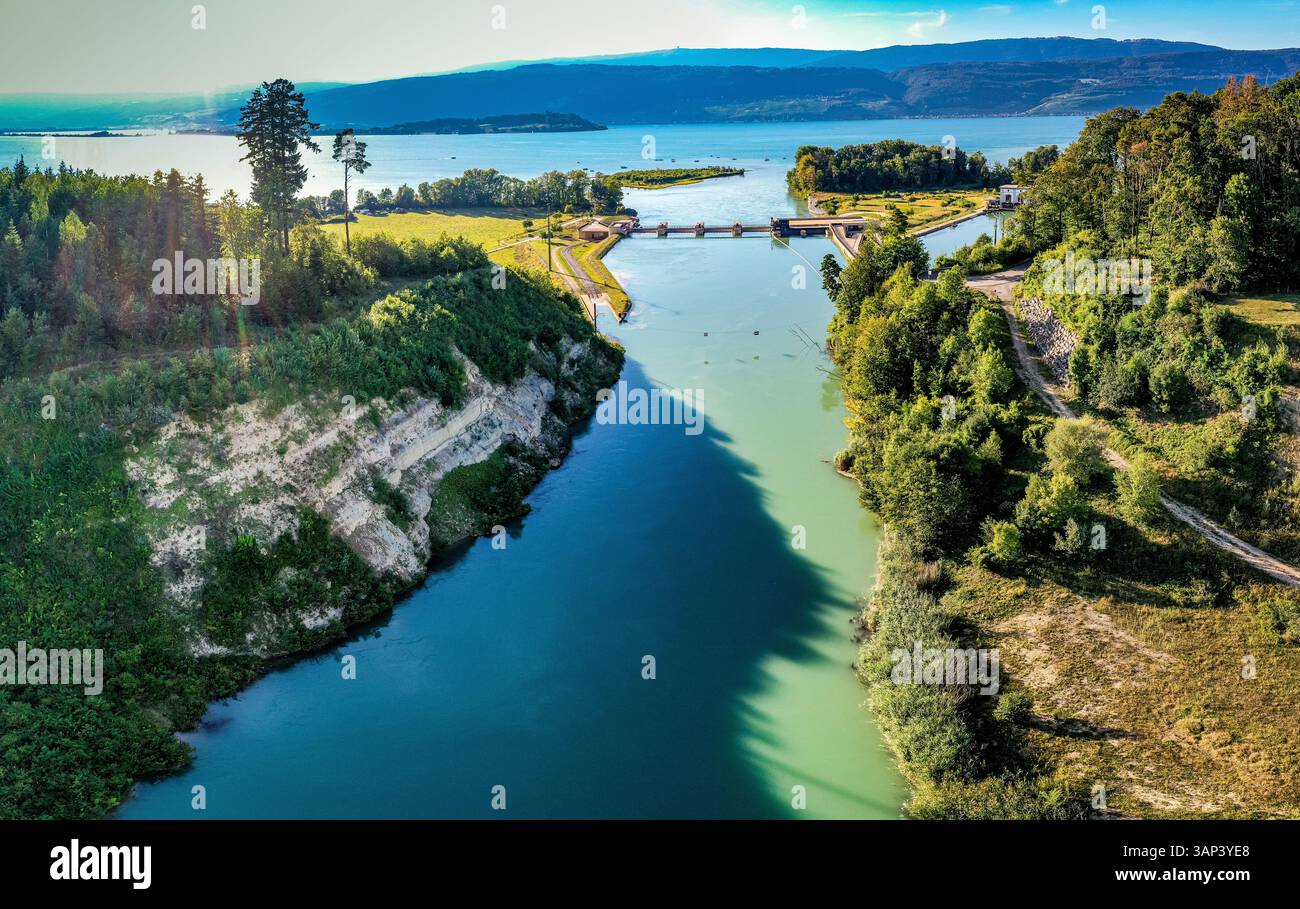 Aerial view of serene river Aare & Lake Biel with forest, mountains ...