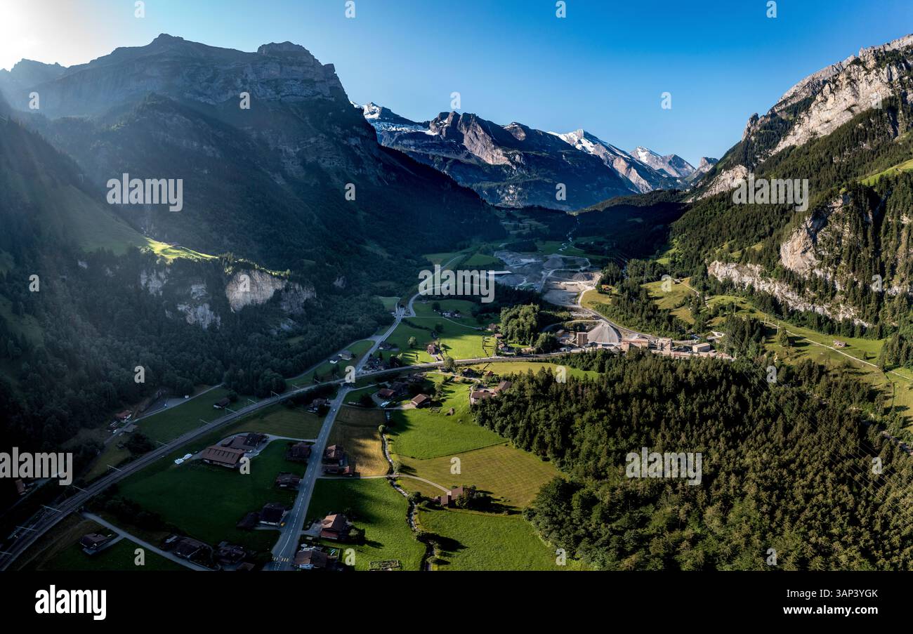 Aerial view of scenic village nestled in Bern with majestic mountains ...