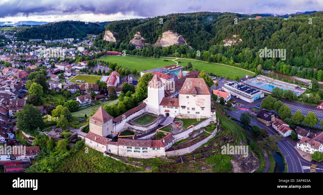 Aerial view of Castle Burgdorf surrounded by town, forest, and valley ...