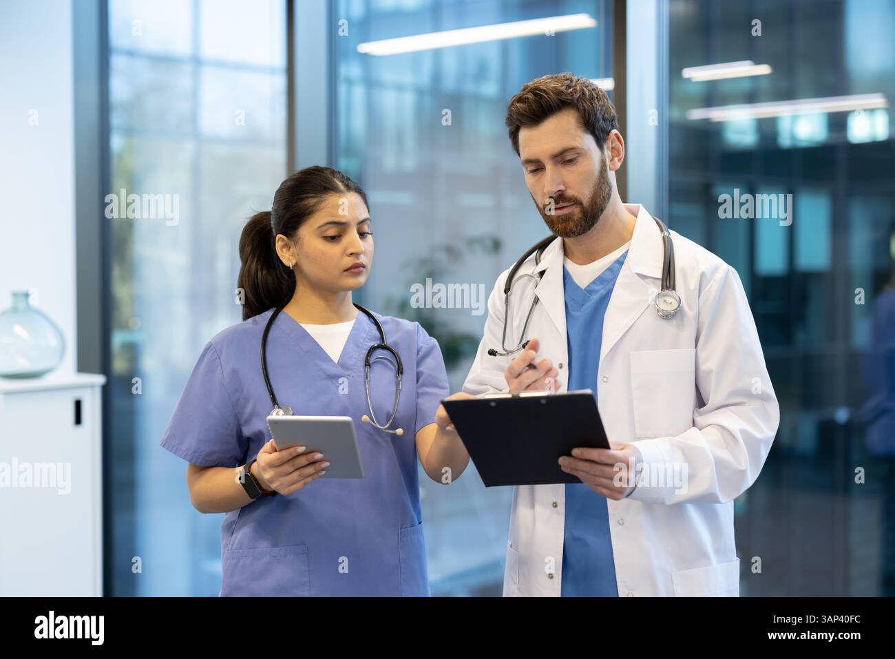 Healthcare professionals review medical charts hi-res stock photography ...