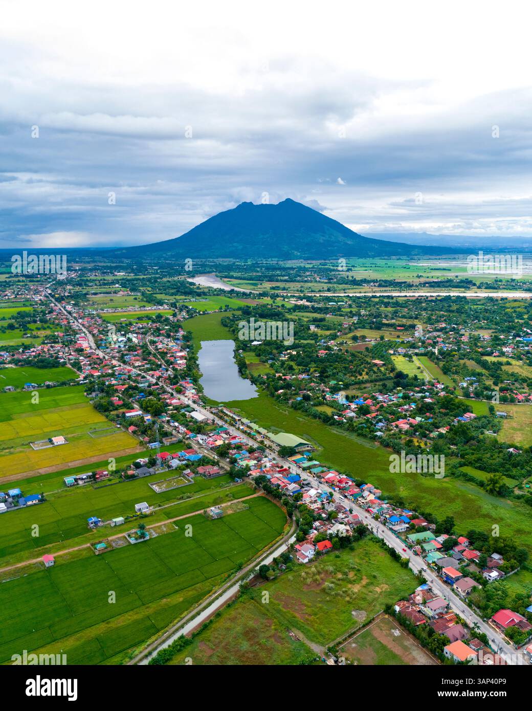 Aerial drone view of Mt. Arayat with busy street, North of Manilla, The ...