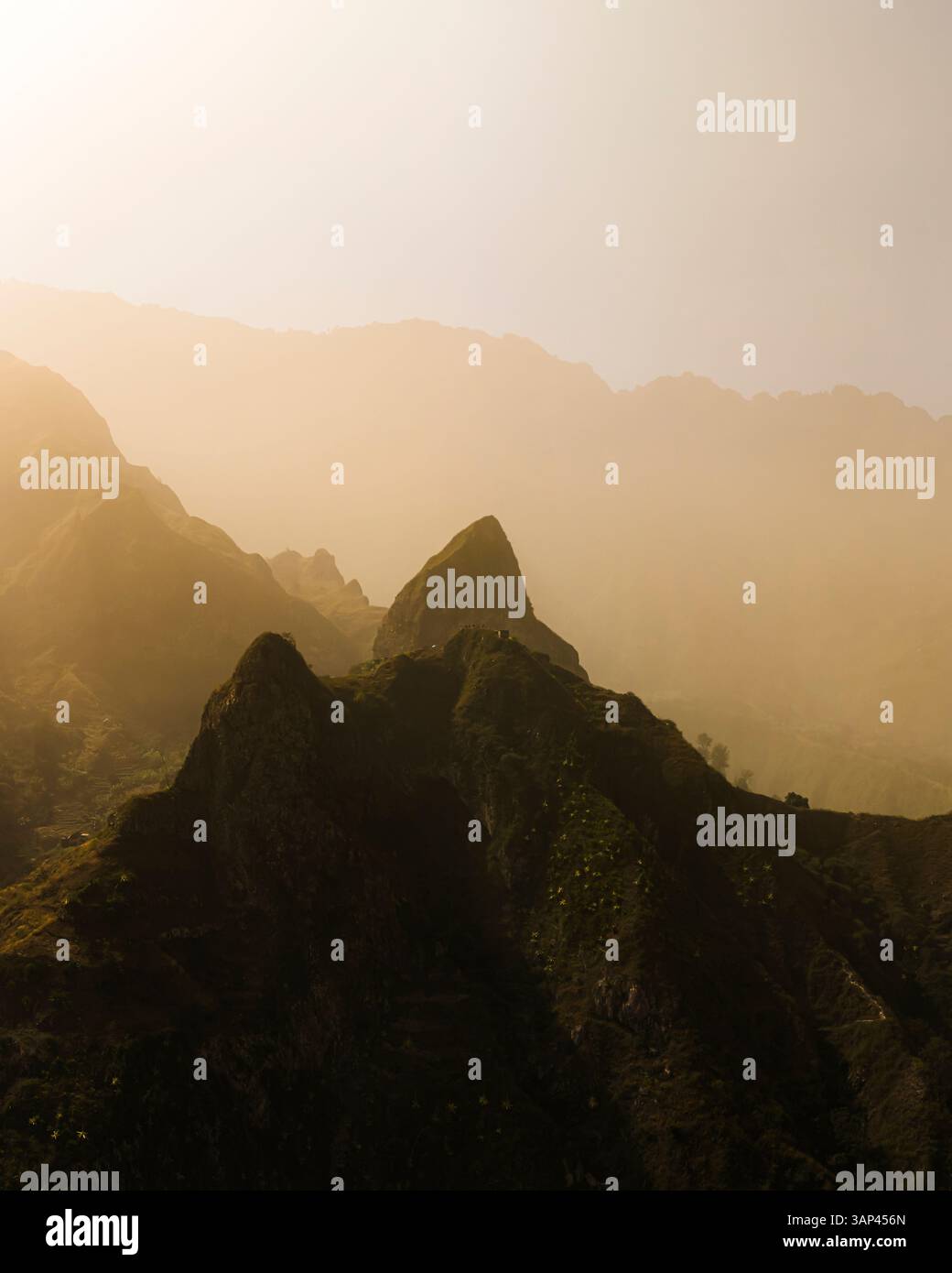 Aerial drone view of mountain peaks during Sahara sandstorm, wide ...