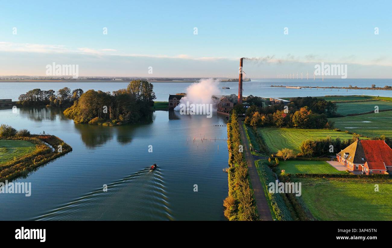 Aerial drone view of an steam pumping station during sunset at Lemmer ...