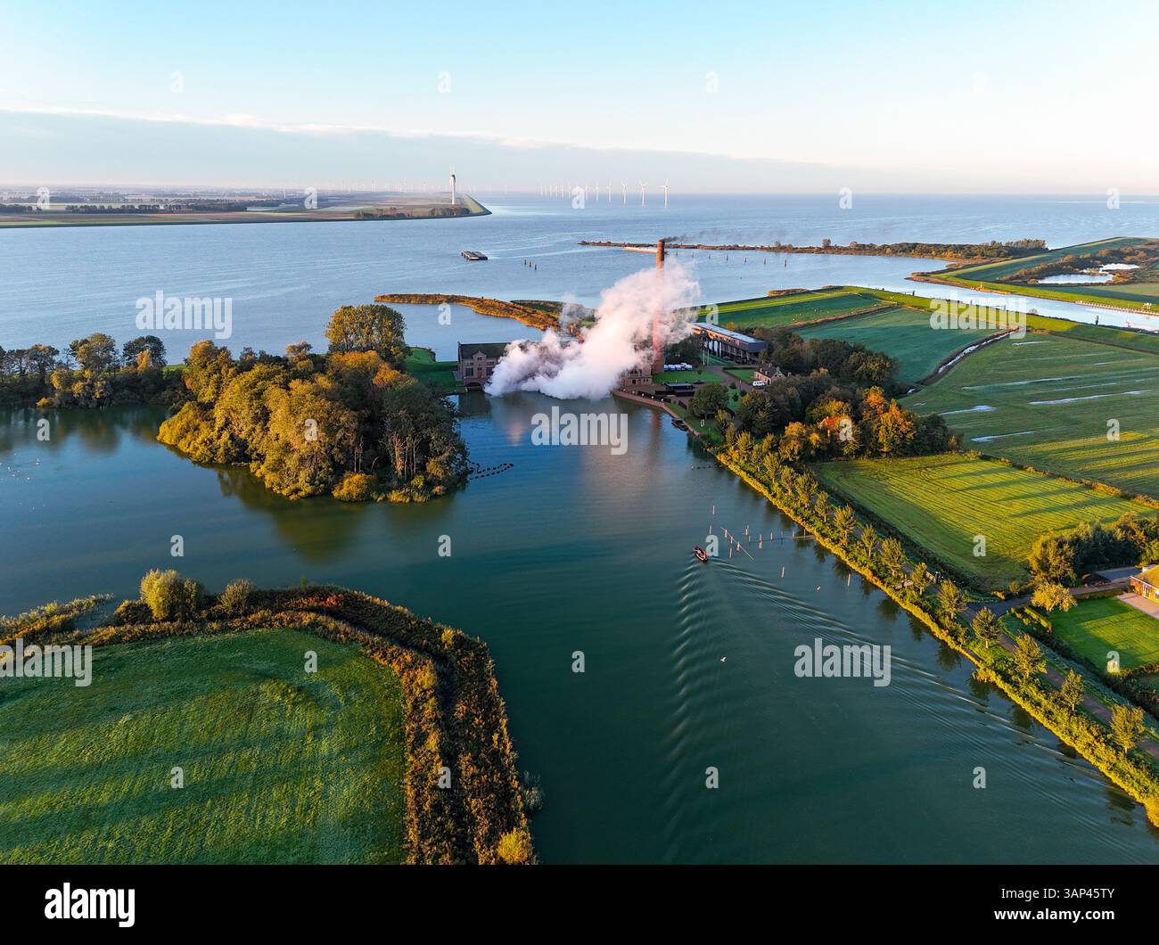Aerial drone view of an steam pumping station during sunset at Lemmer ...