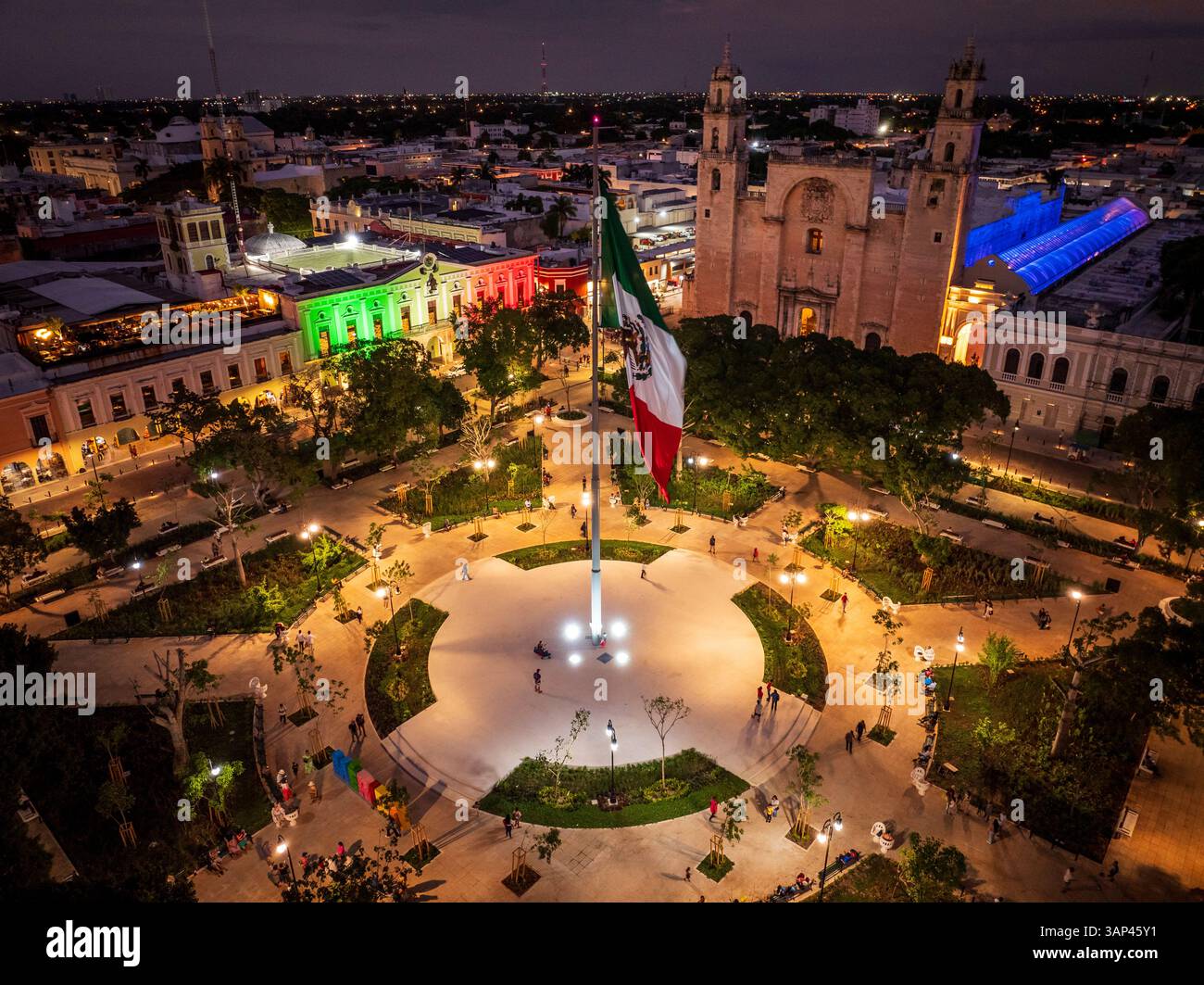 Aerial view of vibrant Plaza Grande with illuminated colonial buildings ...