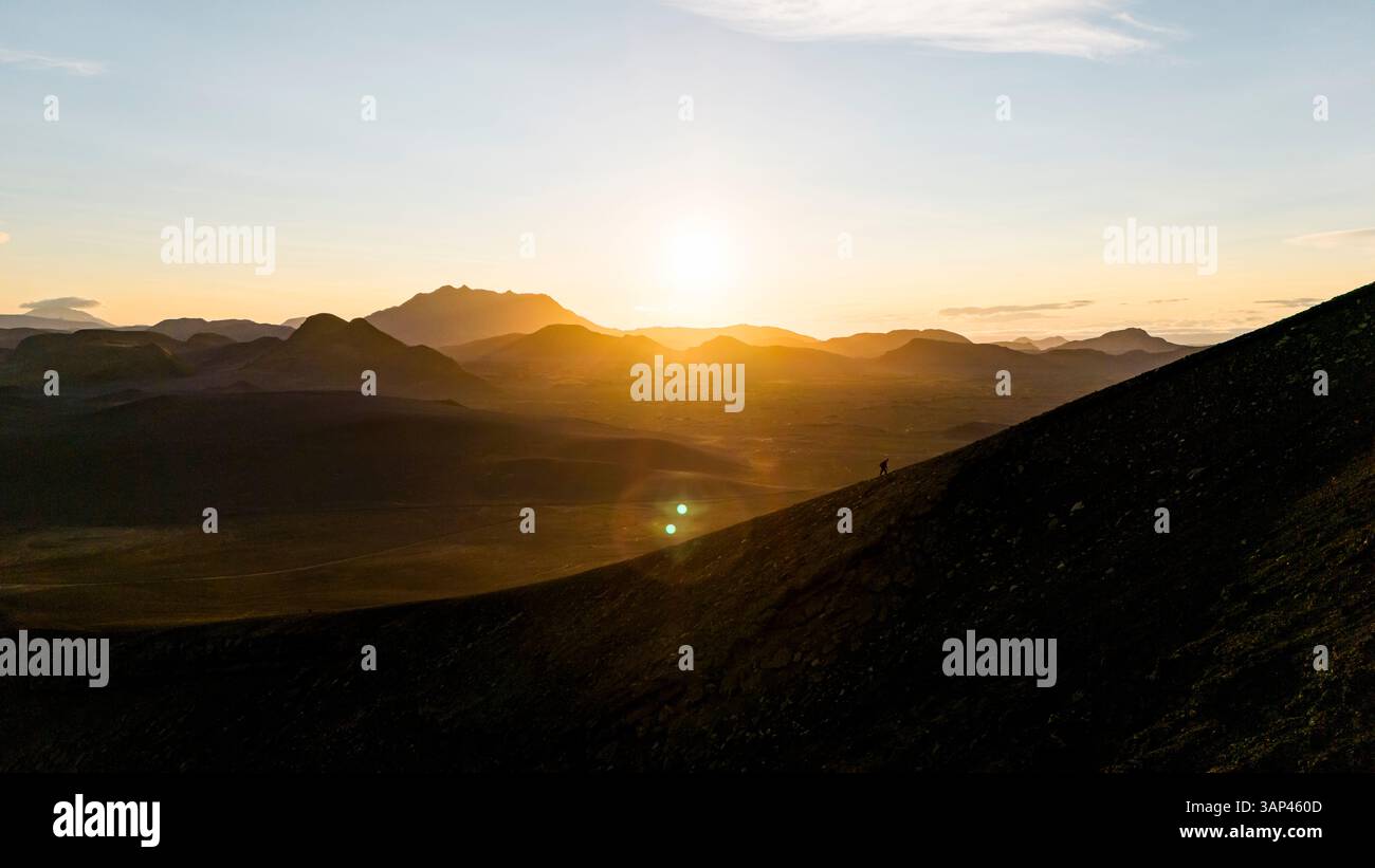 Aerial drone view of a silhouette person walking uphill on Blahylur ...