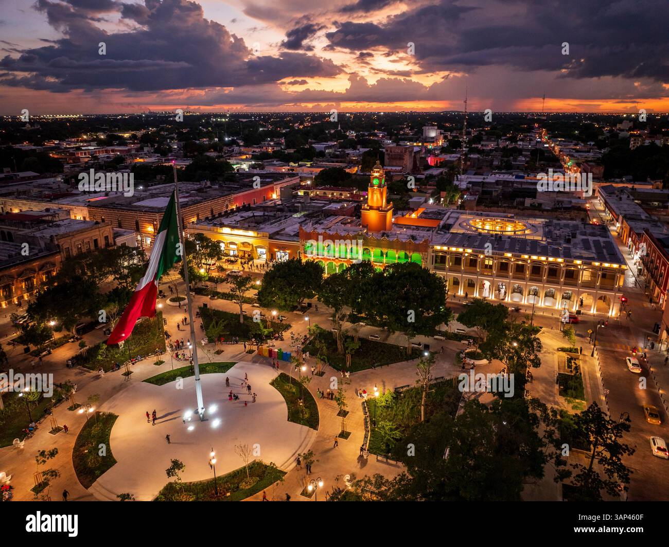Aerial view of Plaza Grande at sunset with vibrant buildings and trees ...
