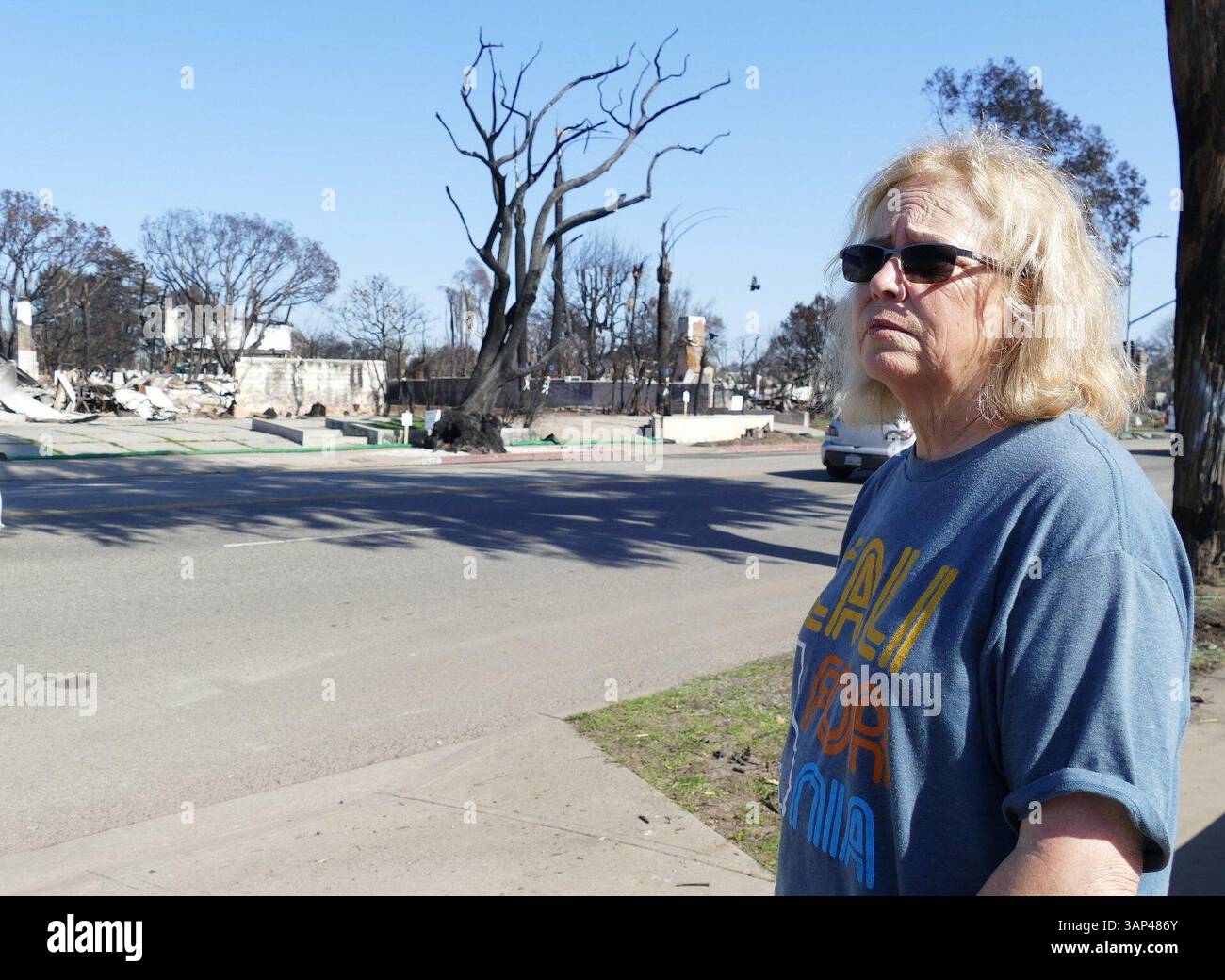Los Angeles, USA. 26th Feb, 2025. Resident Nancy Bellinger stands in ...