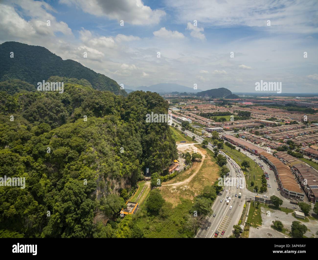 Aerial view of Ipho cityscape surrounding by mountain, Perak, Malaysia ...