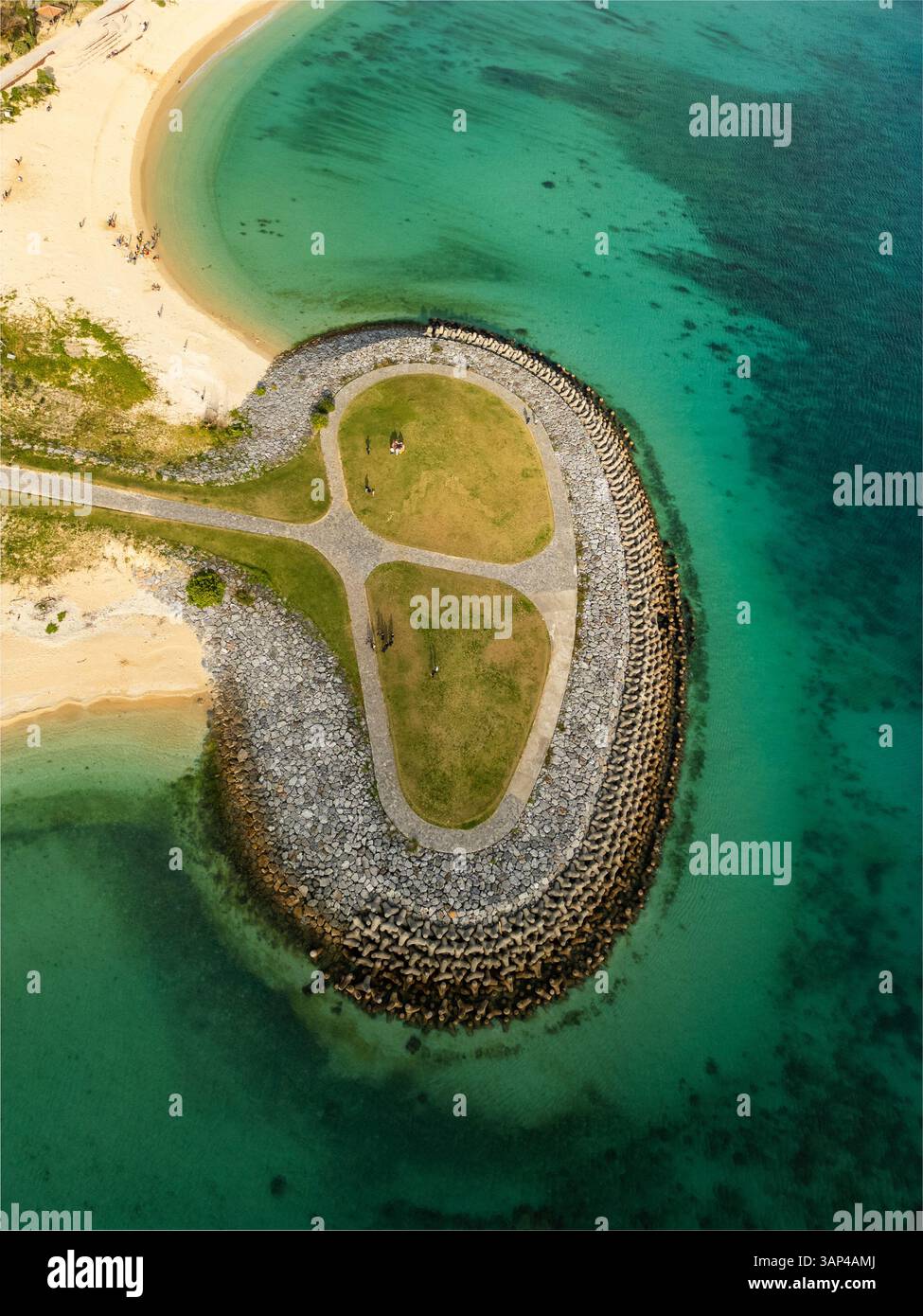 Aerial view of serene seikinomori beach with turquoise water and rocky ...