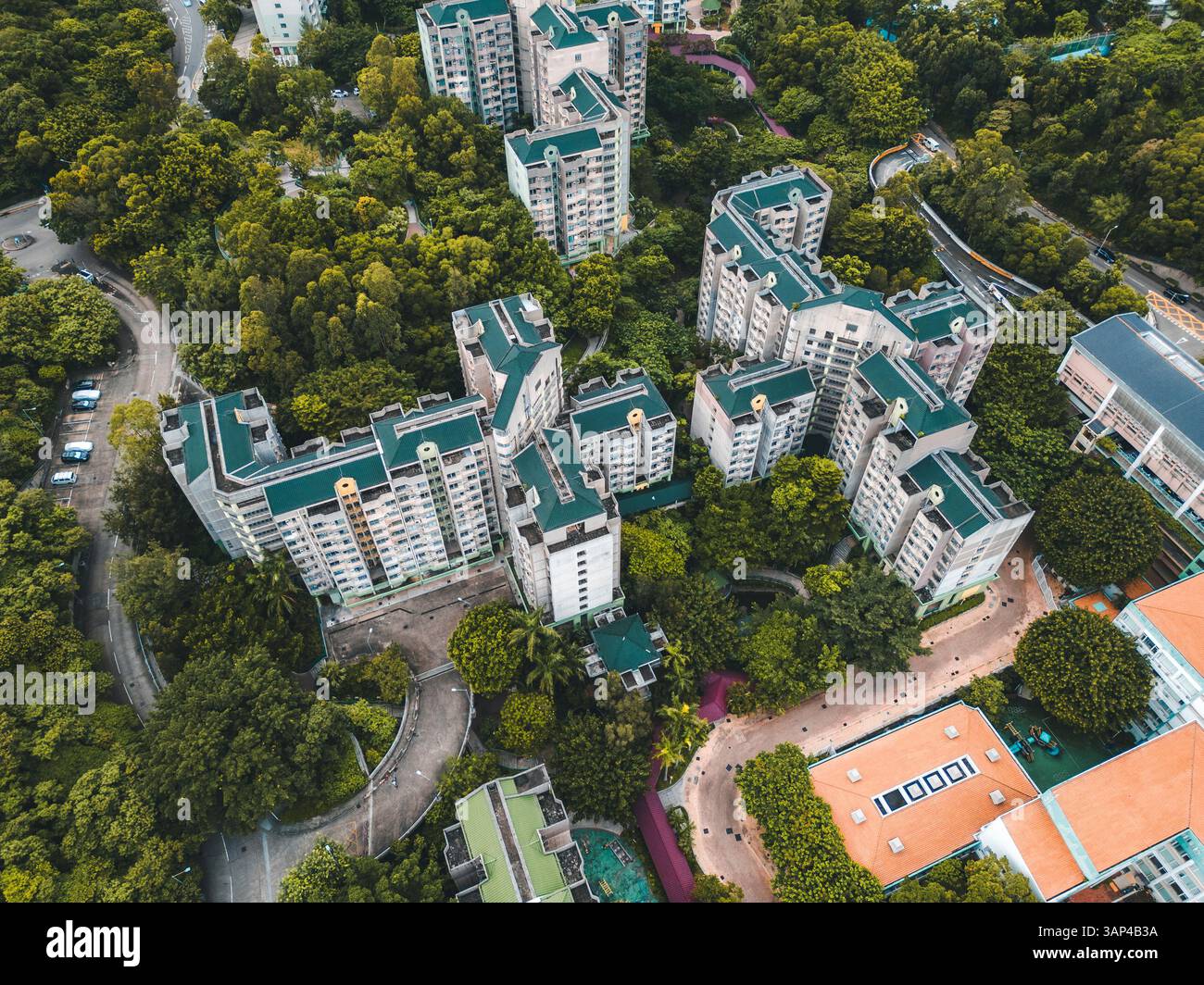 Aerial view of modern residential buildings and lush greenery in a ...