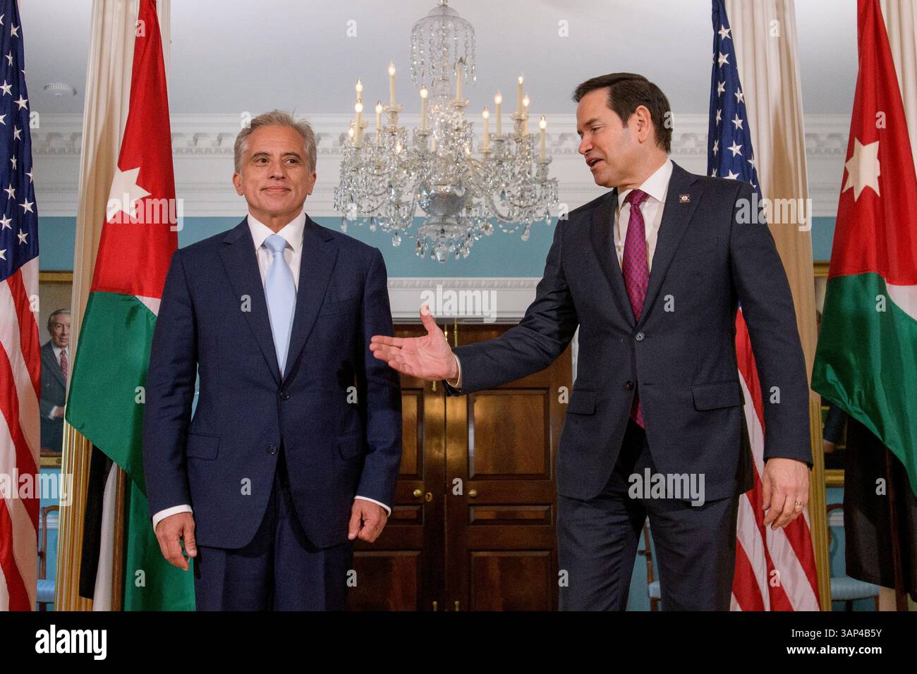 Secretary of State Marco Rubio, right, reaches out to shake the hand of ...