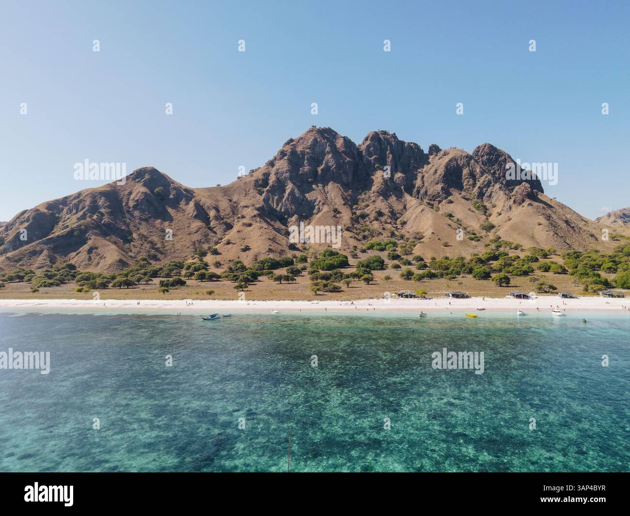Aerial panoramic view of Pink Beach Island in Labuan Bajo with ships ...