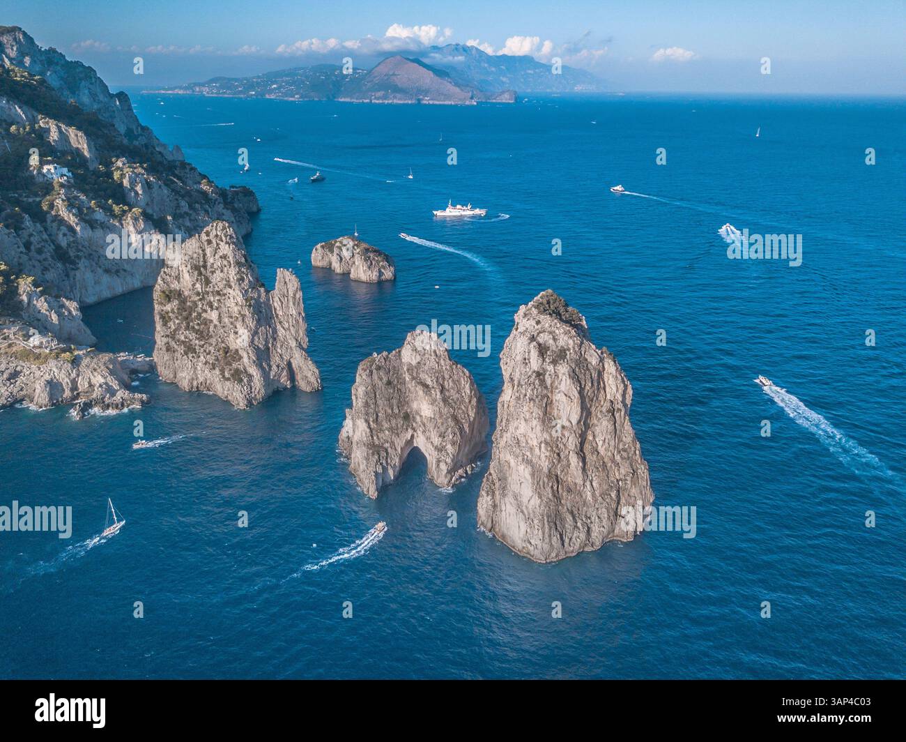 Aerial view of faraglioni di capri with azure sea and picturesque rock formations, Capri, Italy ...