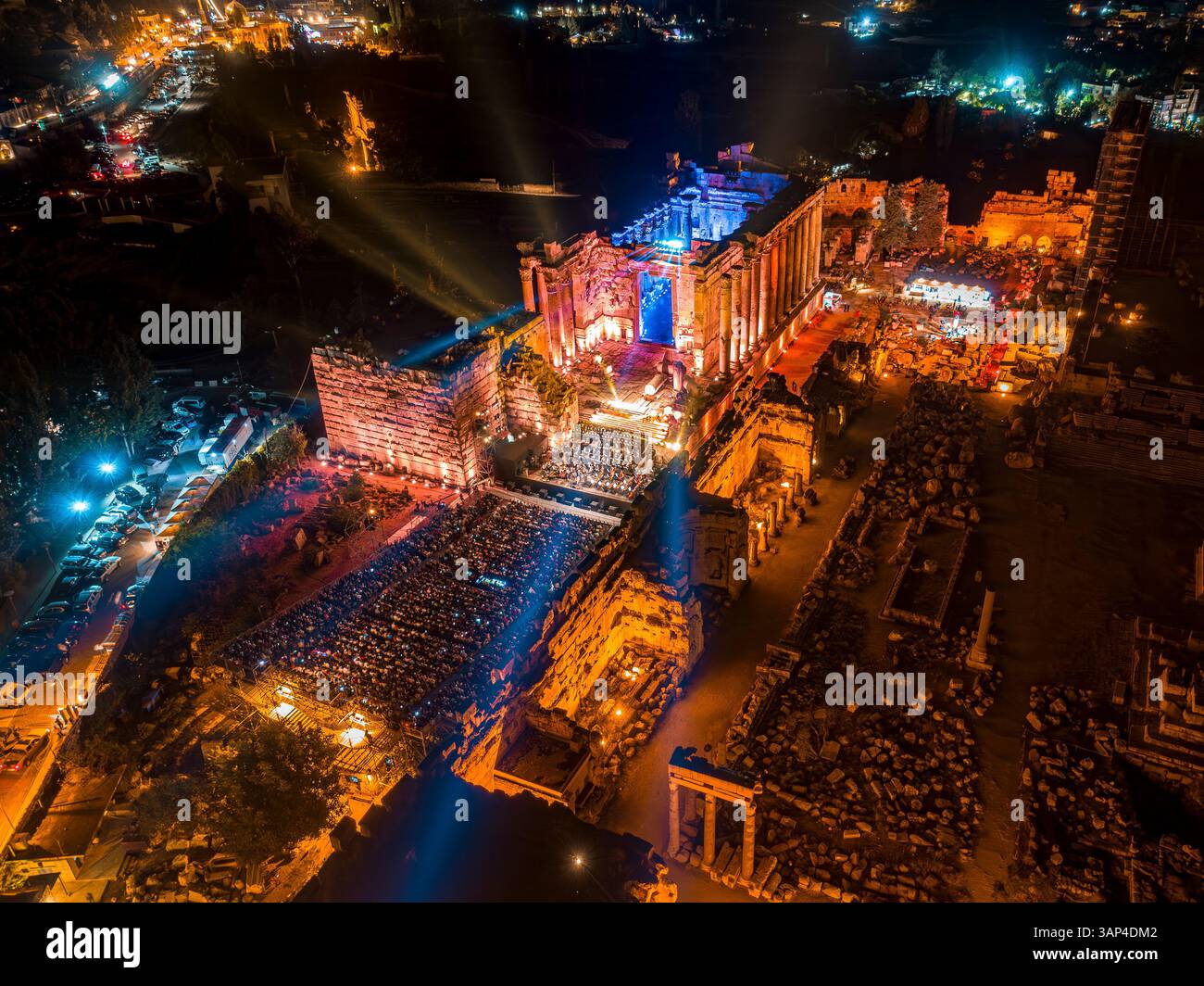 Aerial view of people at Baalbek Festival at night around the Baalbek ...